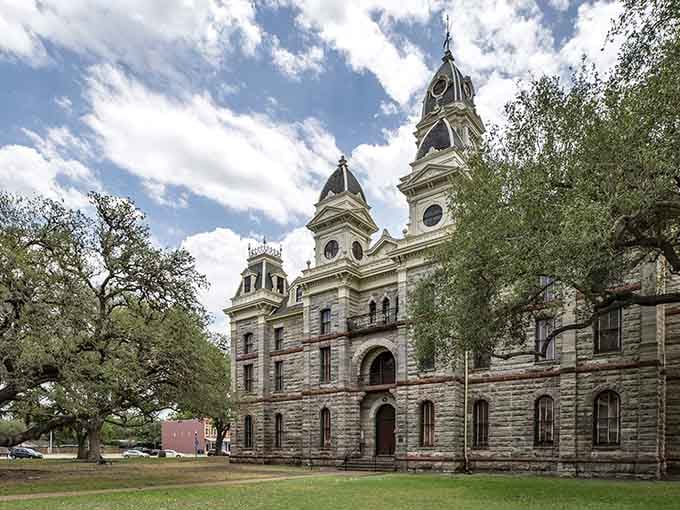 Goliad County Courthouse rises majestically with twin towers that command respect while welcoming visitors to explore its grounds.