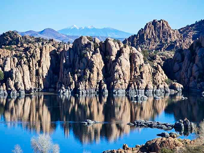 Snow-dusted granite peaks create a winter wonderland that looks like a fantasy novel cover come to life.
