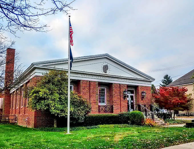 The post office sits pretty in red brick, making even your utility bills feel like they're arriving with a touch of class.
