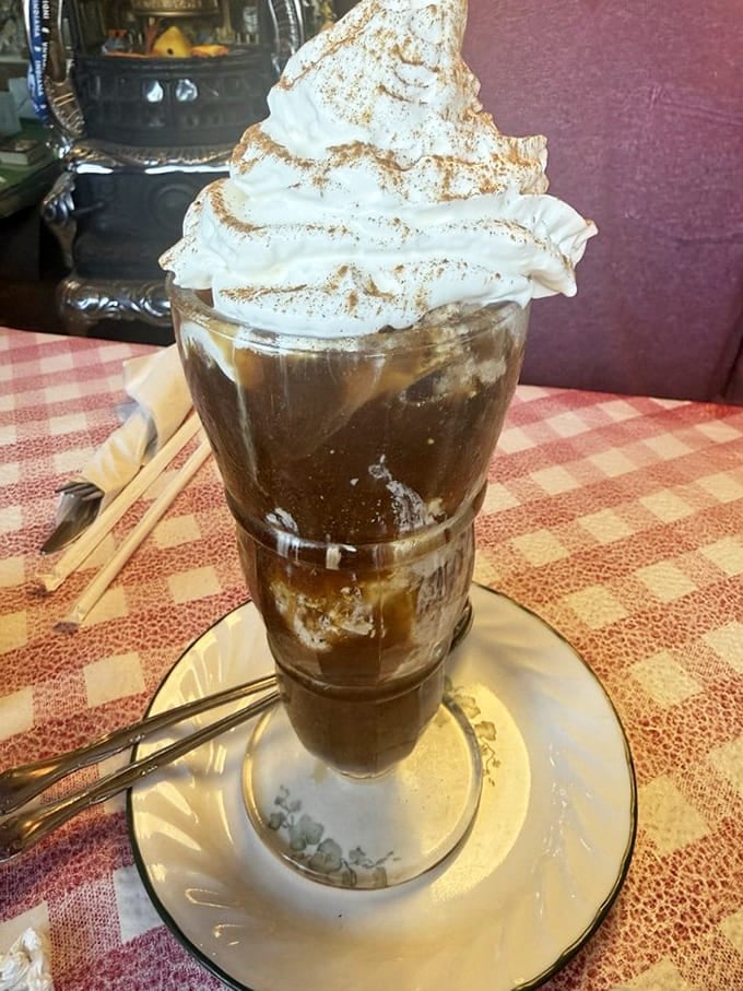 That whipped cream tower defies physics and possibly several laws of nature, but who's complaining about excess here?