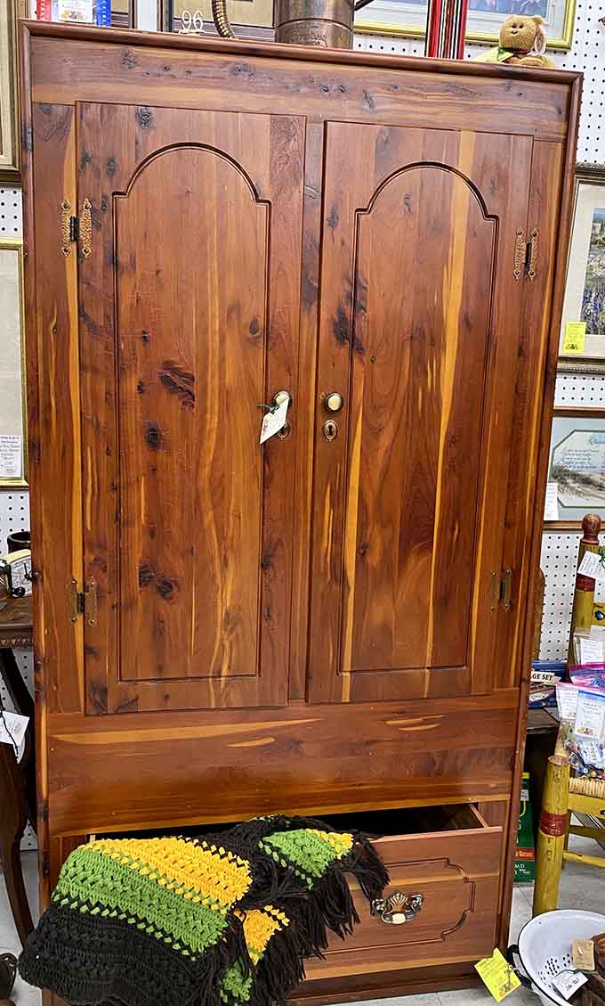 This wooden cabinet survived decades of family secrets and probably knows where all the good silverware went during Thanksgiving arguments.