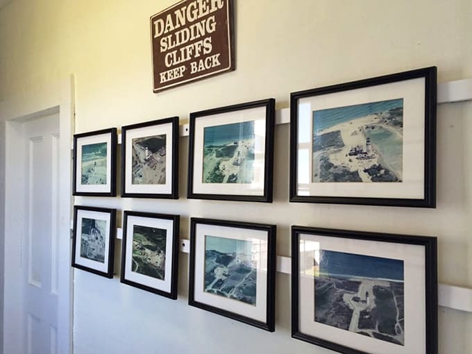 Historical photos document the cliff's relentless march toward the lighthouse, nature's slowest chase scene ever filmed.