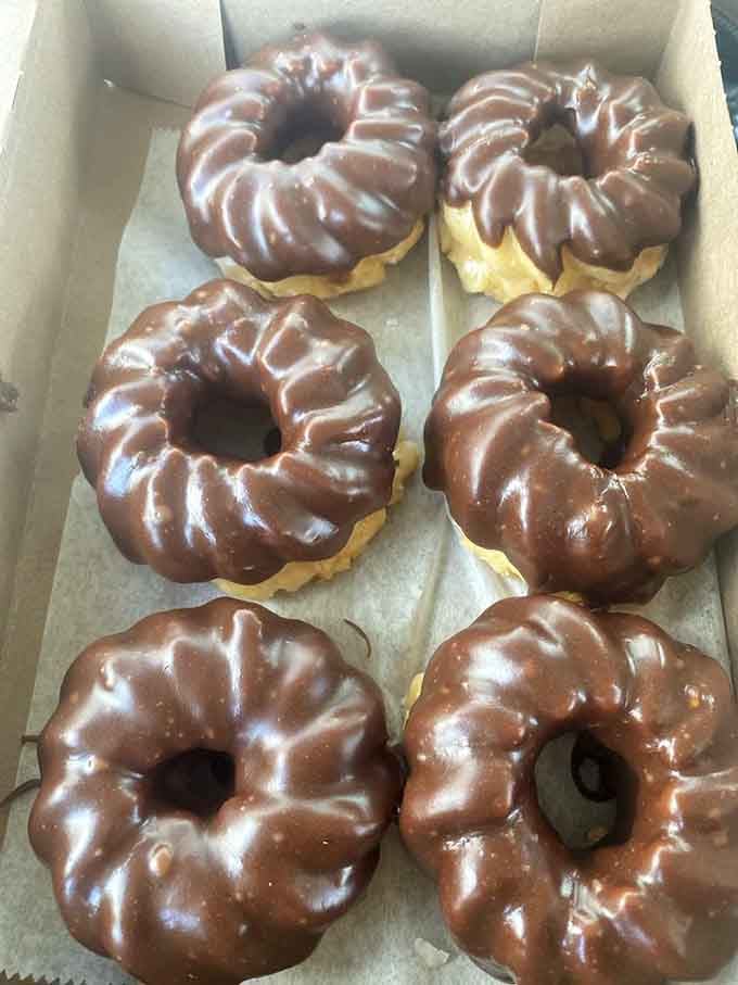 Chocolate-covered donuts with that distinctive ridged shape, proving that some classics never need updating or improvement.