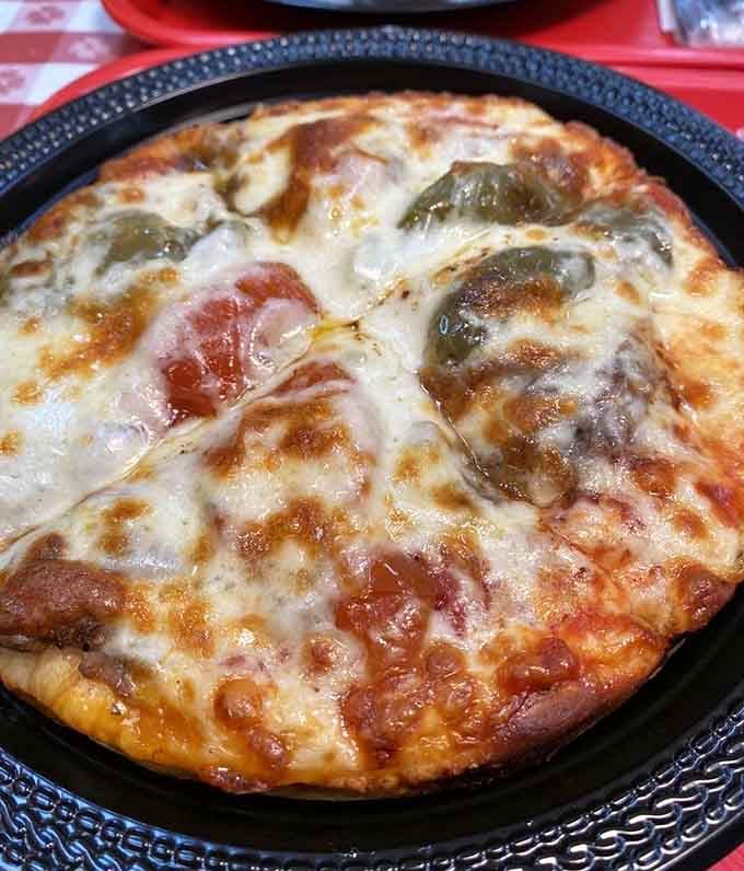 Chicago meets Italy in this pan pizza masterpiece. The cheese stretches into those perfect Instagram-worthy pulls, but nobody's taking pictures&mdash;they're too busy eating.