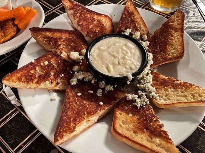 Garlic bread arranged like edible art, complete with blue cheese crumbles that add sophistication to pure comfort.