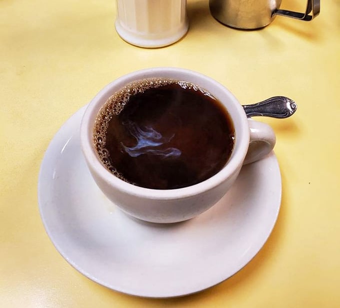 Strong black coffee: the universal language of morning optimism and afternoon survival, beautifully translated here.