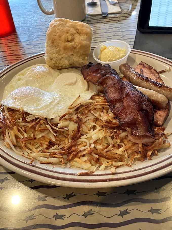 Biscuits, gravy, bacon, sausage, eggs, and hash browns, this plate understands that breakfast isn't the time for minimalism.