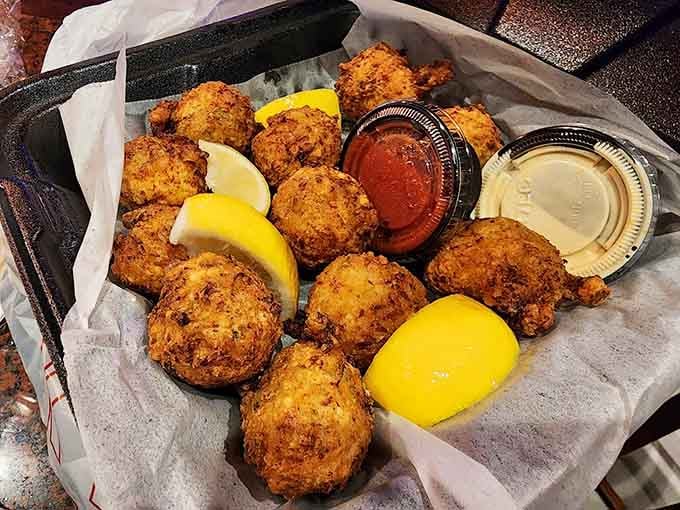 Conch fritters achieving that impossible golden perfection that makes you forget you ever ordered anything else for the meal.