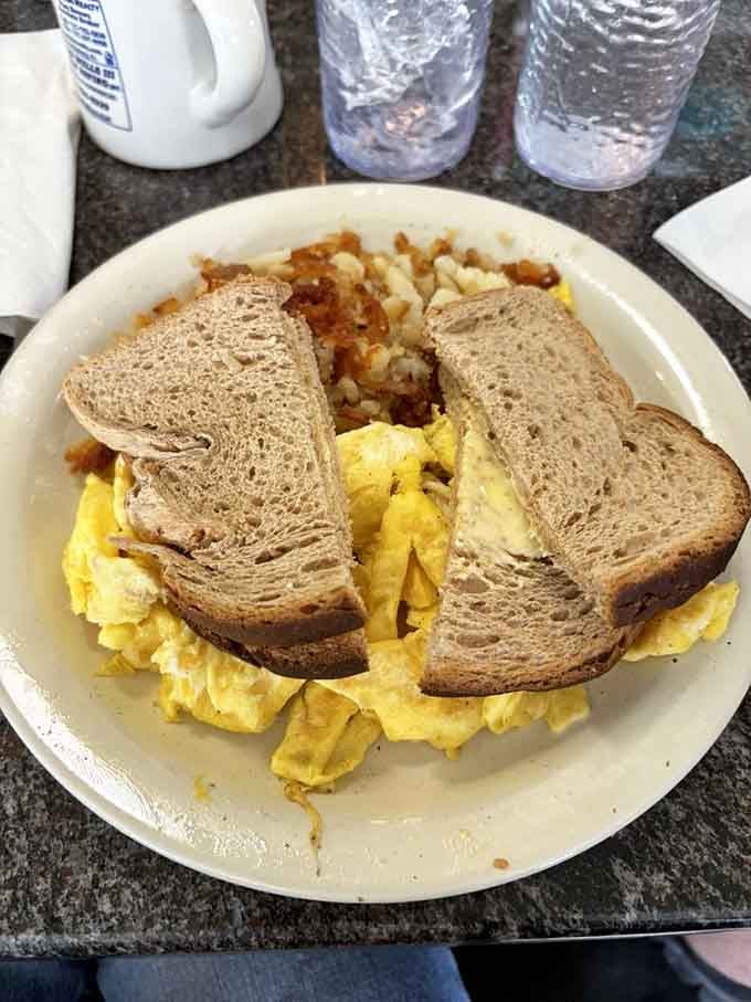 Sometimes simple is sublime: scrambled eggs done right, crispy home fries, and toast ready for its butter baptism.