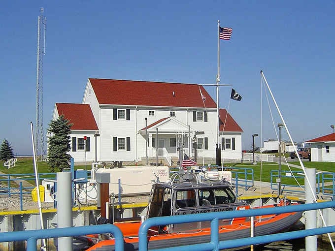 The Coast Guard station stands ready, because even paradise needs someone watching over it with official government dedication.