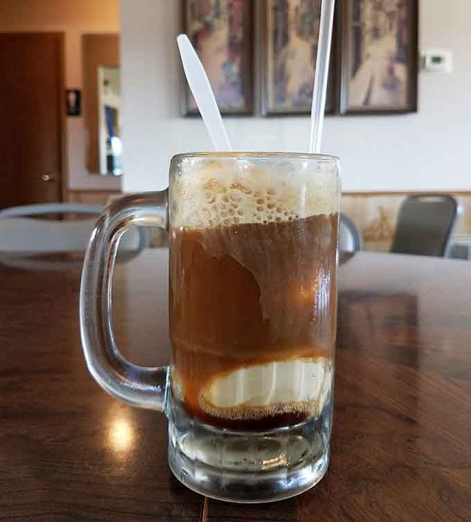 That root beer float is childhood in a glass, reminding you that some pleasures never get old no matter what.