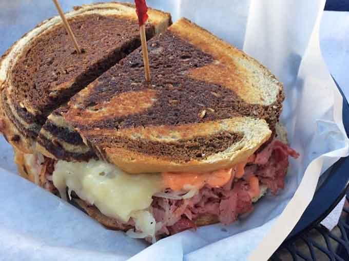 The Triple Play Reuben on marble rye, where three types of meat unite in glorious harmony for your eating pleasure.