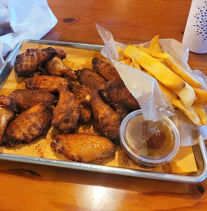Golden-brown wings with fries and sauce create the kind of meal that makes you forget about your diet until tomorrow.