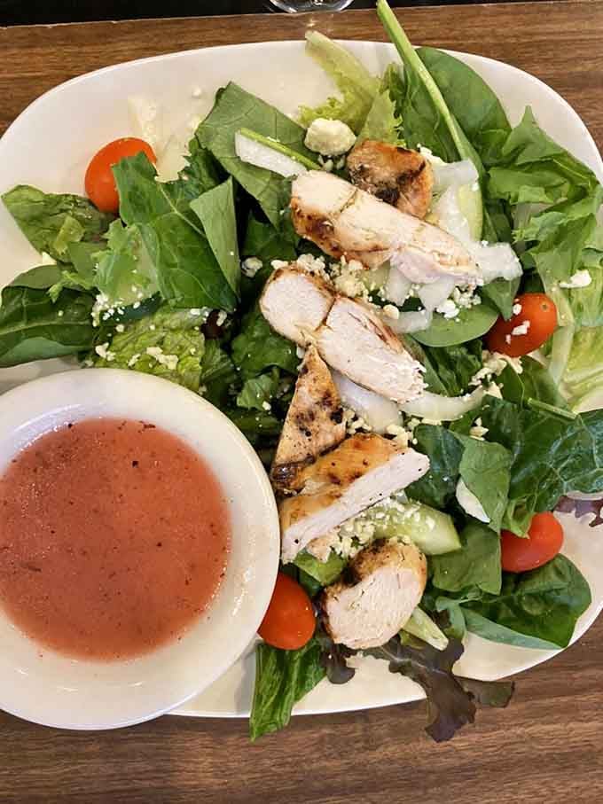 Fresh greens, grilled chicken, feta crumbles, and cherry tomatoes create a lunch option that's both virtuous and delicious.