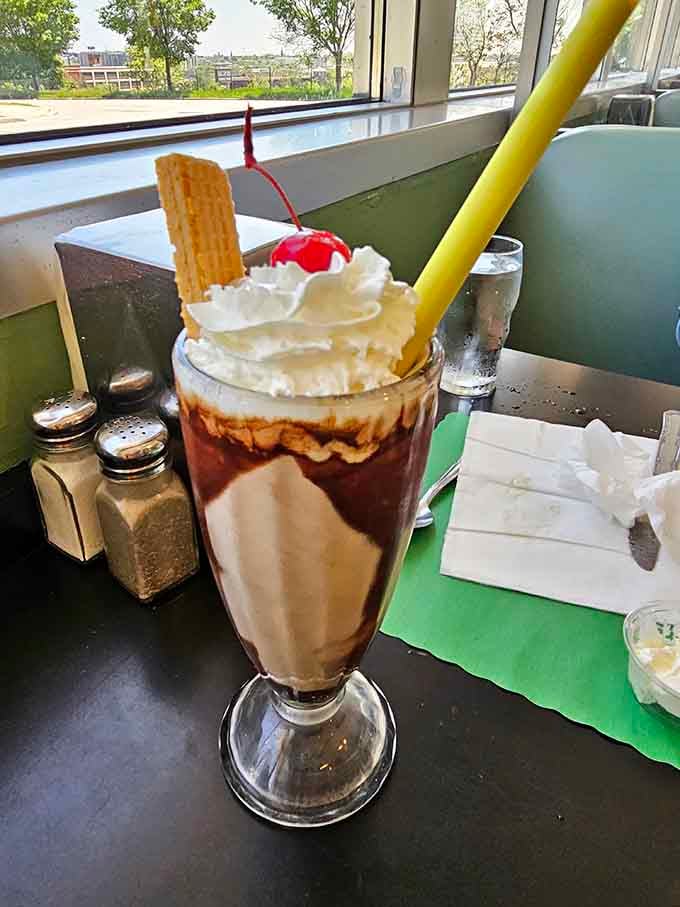 This milkshake comes with whipped cream, a cherry, and the promise of pure happiness.