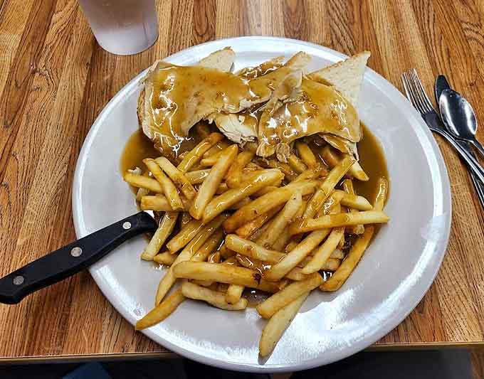 Crispy home fries piled high enough to require architectural support, because moderation is apparently not in their vocabulary here.