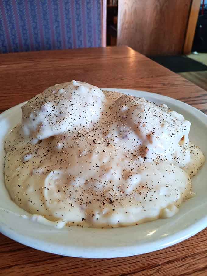 Biscuits drowning in sausage gravy, the kind of comfort food that makes everything else seem trivial.