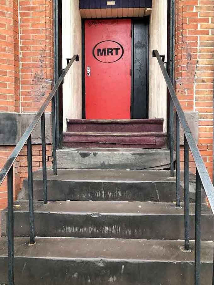 That red door marked MRT is your portal to a dimension where normal decorating rules simply don't apply here.