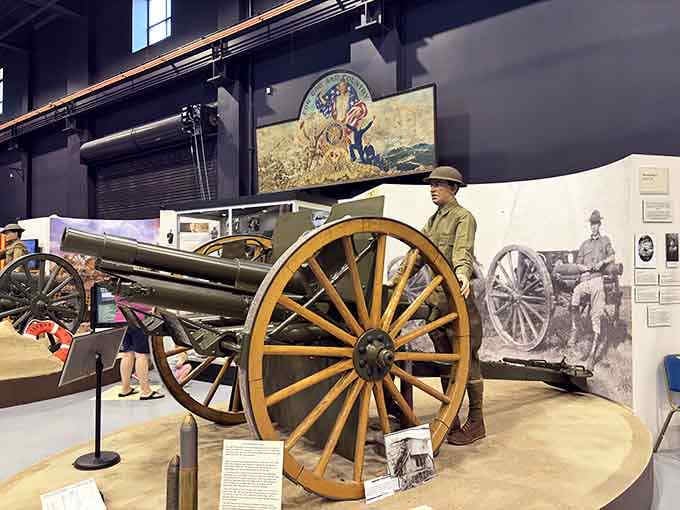 This field gun's wooden wheels and steel barrel bridge centuries of military technology, from horse-drawn artillery to the modern battlefield.