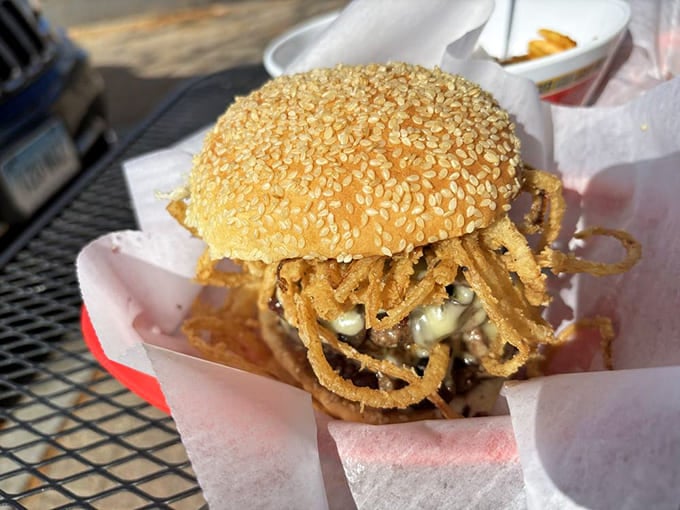 The Mushroom Steakhaus burger with crispy onions perched on top like a crown. Royalty in sandwich form.