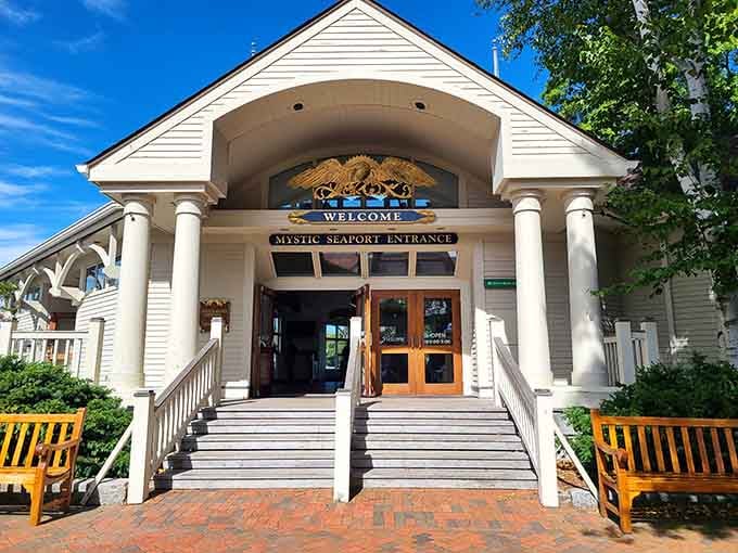 The welcoming entrance to Mystic Seaport Museum promises maritime adventures without the scurvy or seasickness that plagued actual 19th-century sailors.