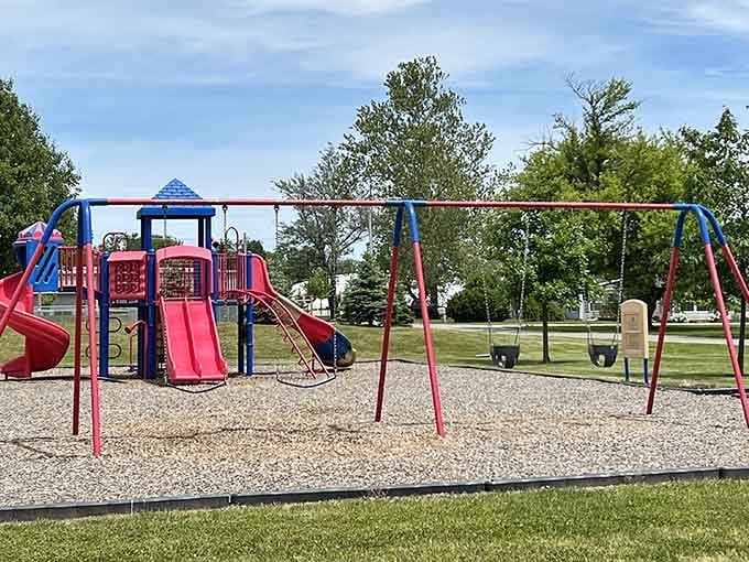 A cheerful playground where kids can actually play outside without screens, swings and slides included, batteries definitely not required for operation here.