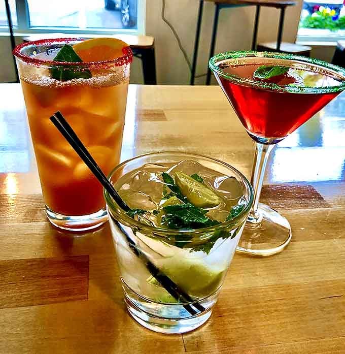 Three colorful cocktails lined up like the start of a very good afternoon indeed.