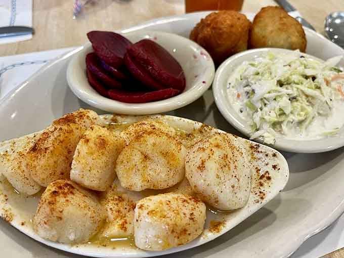 Broiled scallops glistening with butter and spices, tender little pillows of seafood perfection worth celebrating.