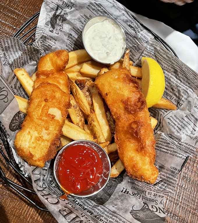 Golden-battered fish and chips served in newspaper wrapping, because some traditions are too good to abandon completely.