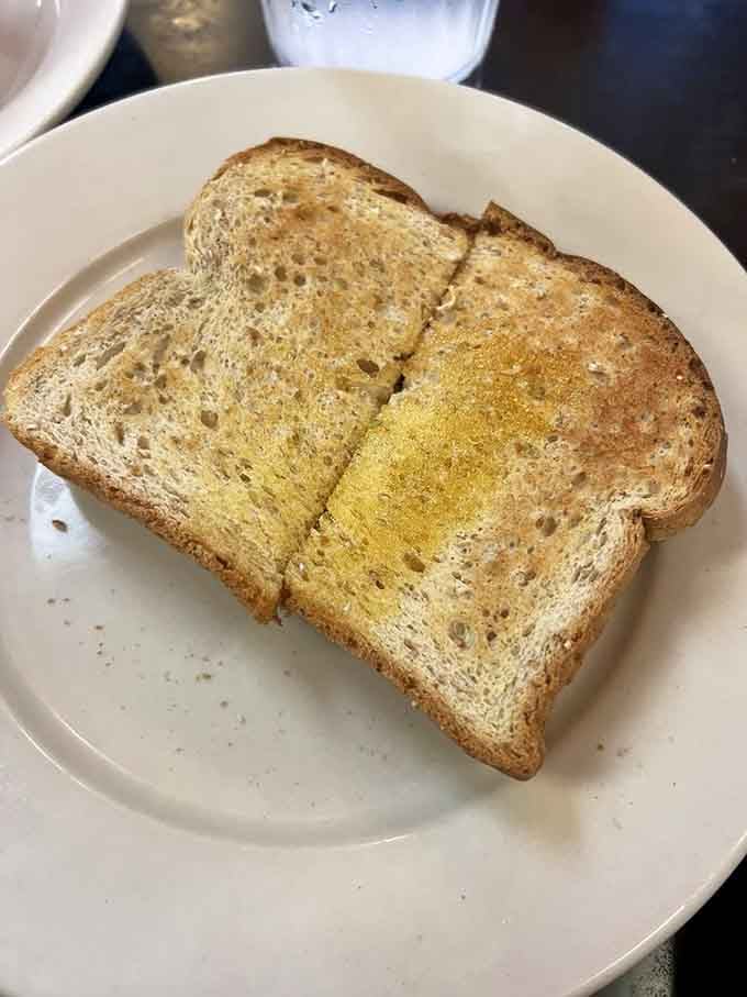 Perfectly toasted wheat bread with butter proves that sometimes the simplest things bring the most satisfaction and joy.