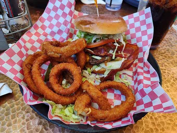 A burger stacked high with onion rings is the kind of architectural achievement that would make any engineer proud.