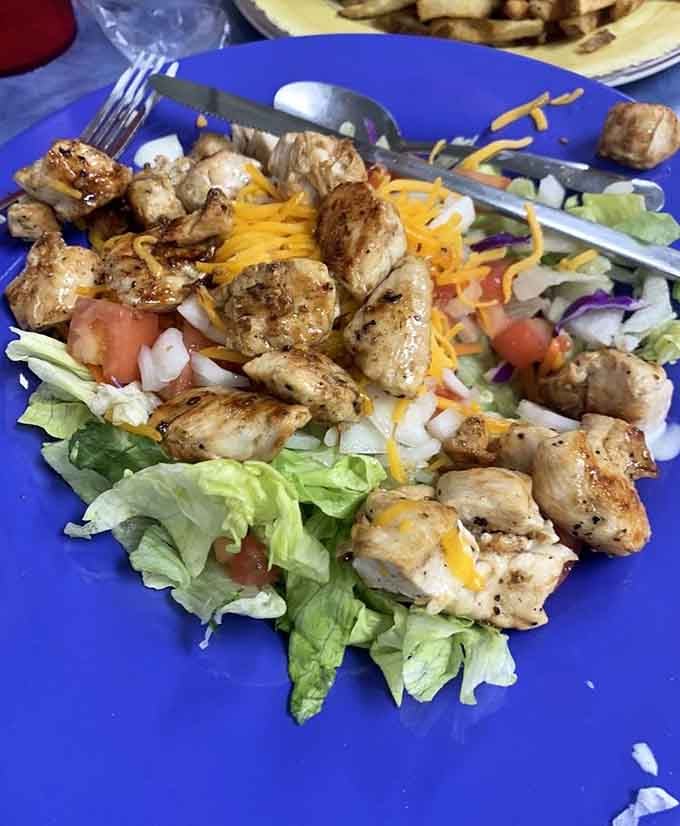 Fresh grilled chicken over crisp greens proves this place knows its way around lunch just as well as breakfast.