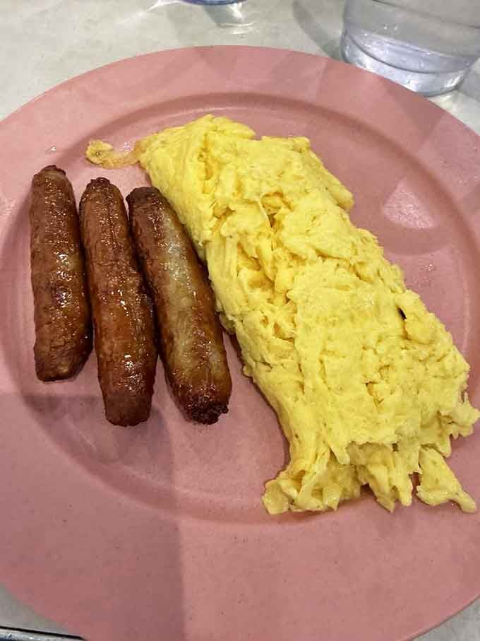 Fluffy scrambled eggs and sausage links proving that sometimes the classics become classics for very good reasons indeed.