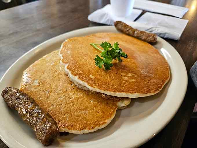 Pancakes the size of vinyl records with a perfect golden-brown exterior that makes you wonder if they hired a pancake artist.