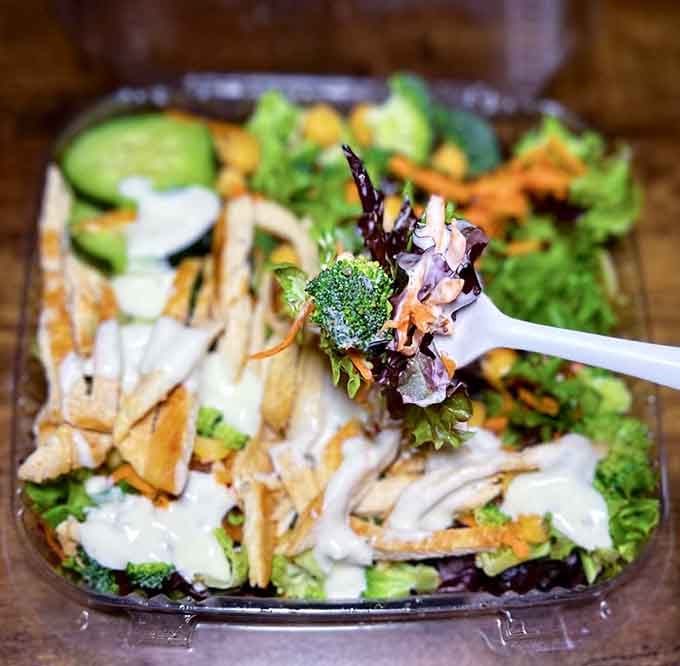 A salad so loaded with grilled chicken it forgot it was supposed to be virtuous and healthy.