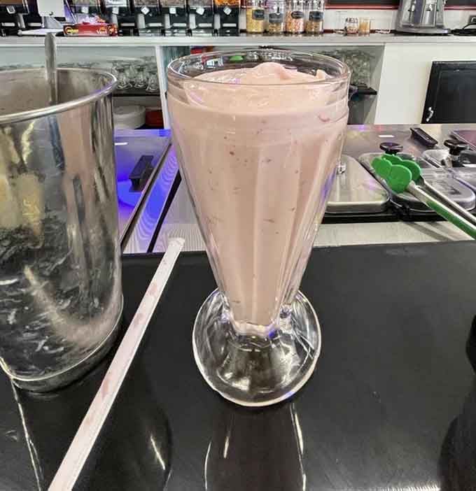 Pink, creamy, and served in proper glassware because some traditions deserve to be maintained with appropriate dignity.