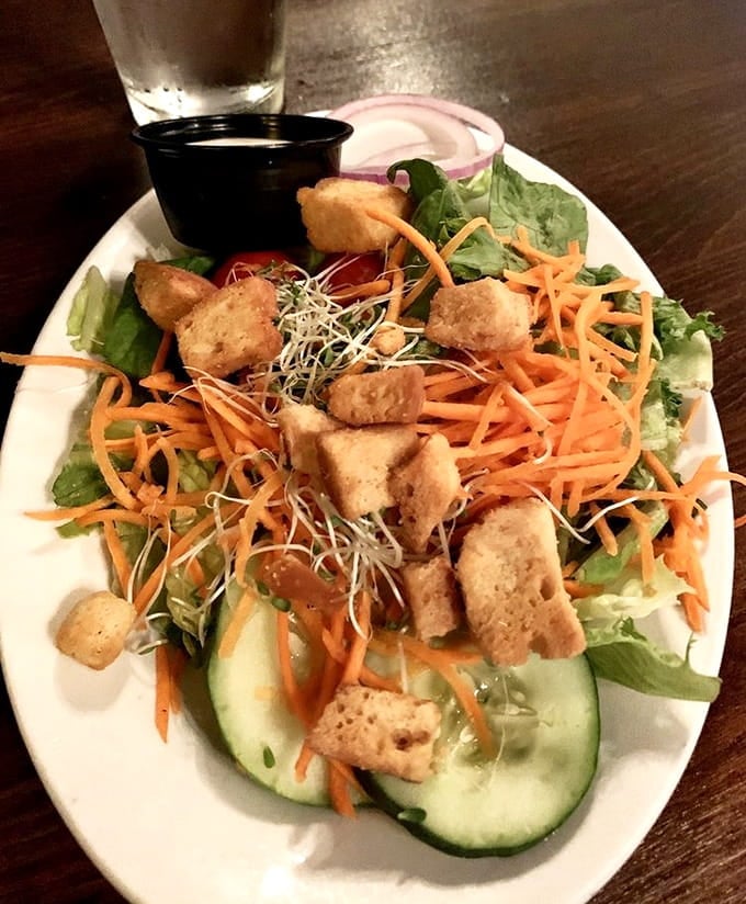 Fresh greens topped with golden-fried goodness prove that salads can be both virtuous and absolutely delicious at once.