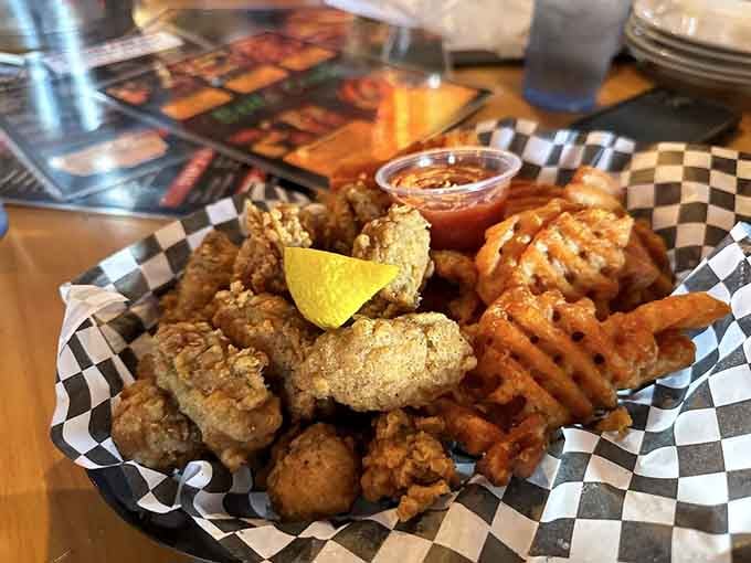 Golden-fried oysters with waffle fries and a lemon wedge deliver that perfect crunch we've been dreaming about since childhood.