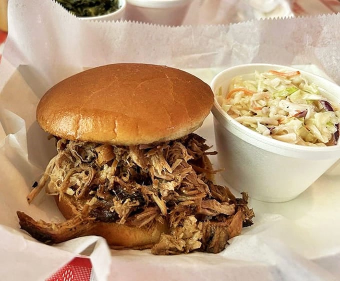 A pulled pork sandwich that requires both hands and several napkins. The coleslaw provides the perfect cool counterpoint to smoky perfection.