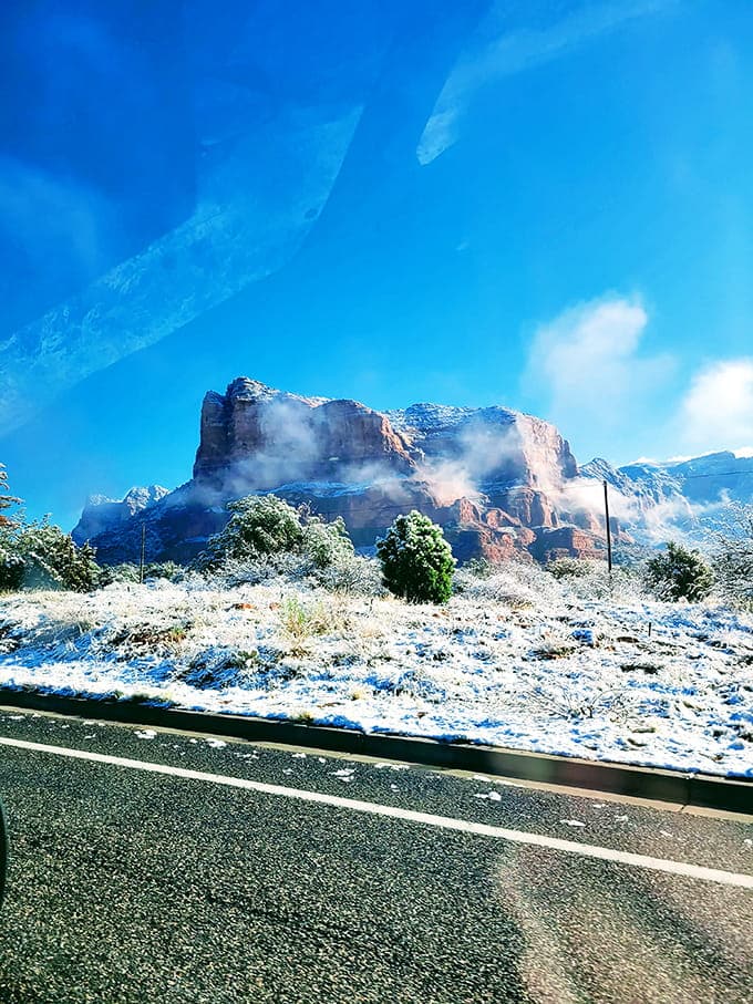 Snow-dusted red rocks create a color combination that shouldn't work but absolutely does, spectacularly.