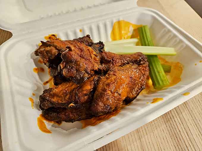 Buffalo wings arrive golden and glistening, ready to test your heat tolerance and napkin supply simultaneously.
