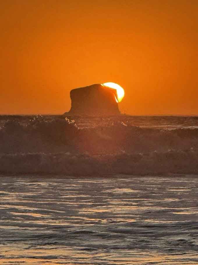 Sunset paints the sky while waves crash, creating the kind of moment that makes you forget your phone exists.