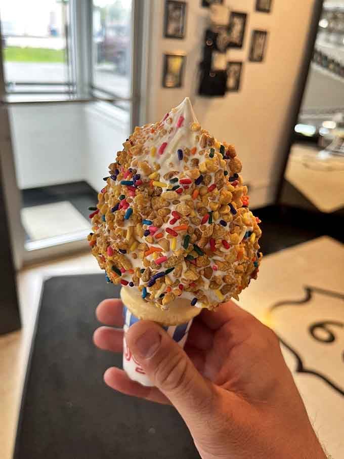 Soft serve covered in sprinkles and cereal because sometimes dessert needs to wear a party hat too.