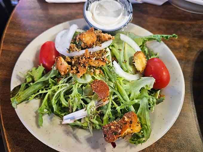 Fresh greens topped with crispy protein prove that even the lighter options here get the same attention to quality and flavor.