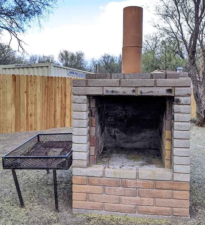 This vintage brick grill and picnic setup proves that even ghost towns can accommodate your lunch plans nicely.