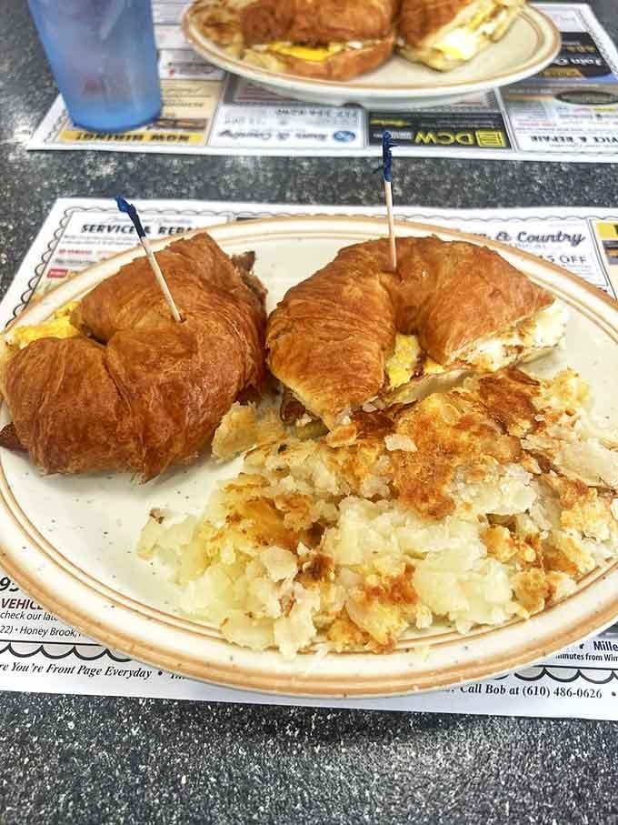 Breakfast croissants that would make a French baker nod in approval, paired with hash browns crisped to that perfect shade of morning gold.