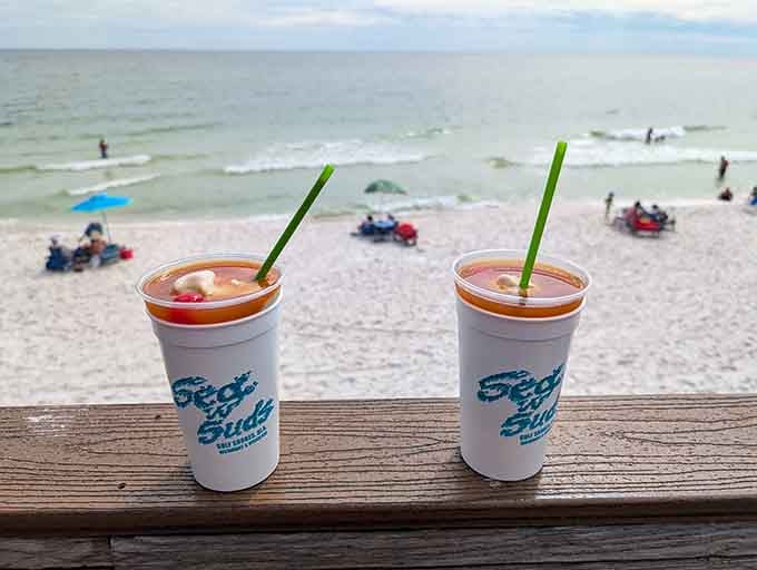 Two cold drinks with a view of the Gulf, because paradise isn't a place, it's a moment like this.