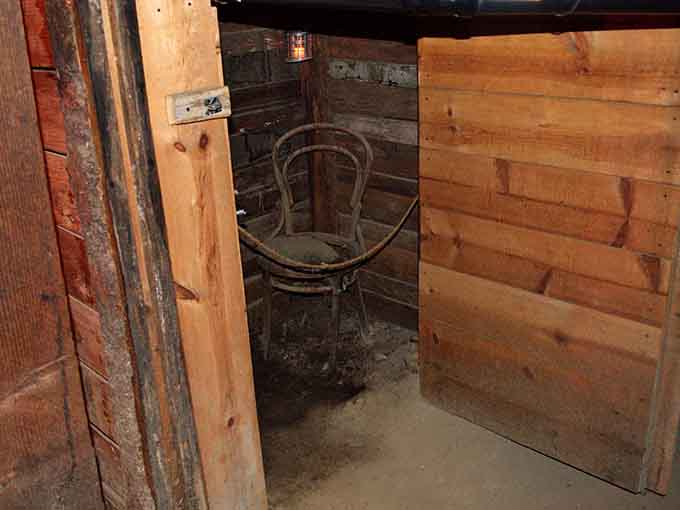 A solitary chair in a cramped space, because apparently kidnapping victims needed somewhere uncomfortable to contemplate their terrible luck.