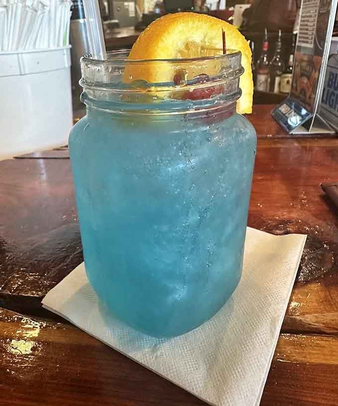 That blue drink matches the ocean vibes and tastes like vacation in a mason jar.