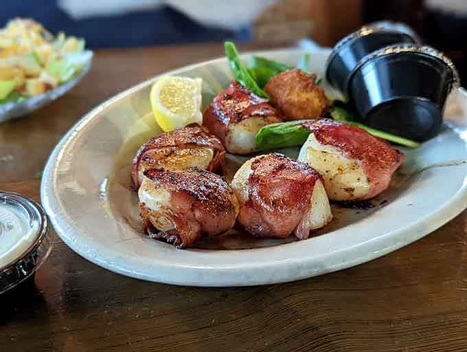 Bacon-wrapped scallops proving that surf and turf doesn't always need steak, just really good judgment and better ingredients.